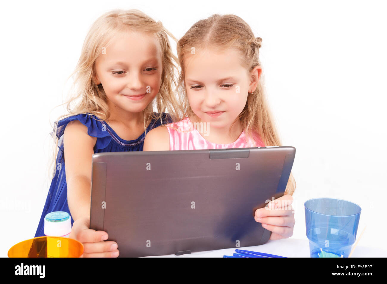 Playful children sitting with laptop Stock Photo - Alamy