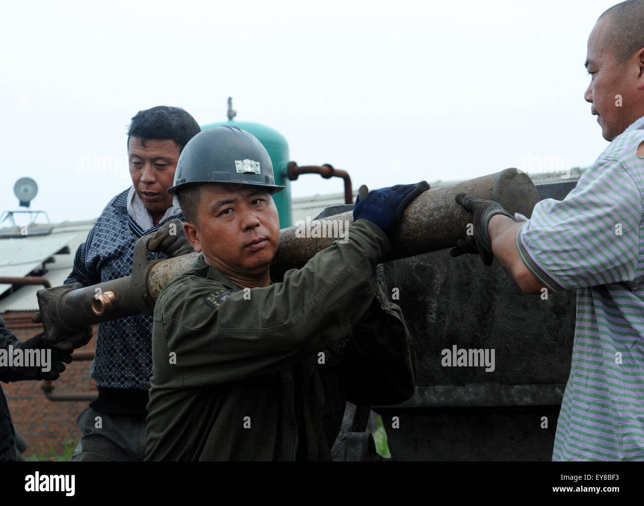 Hegang, China's Heilongjiang Province. 24th July, 2015. Rescuers load ...