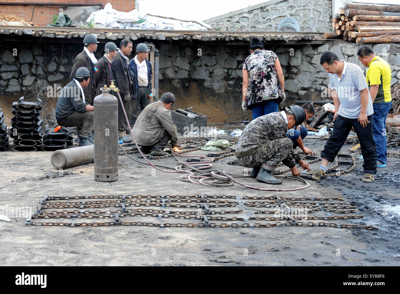 Hegang, China's Heilongjiang Province. 24th July, 2015. Rescuers weld ...