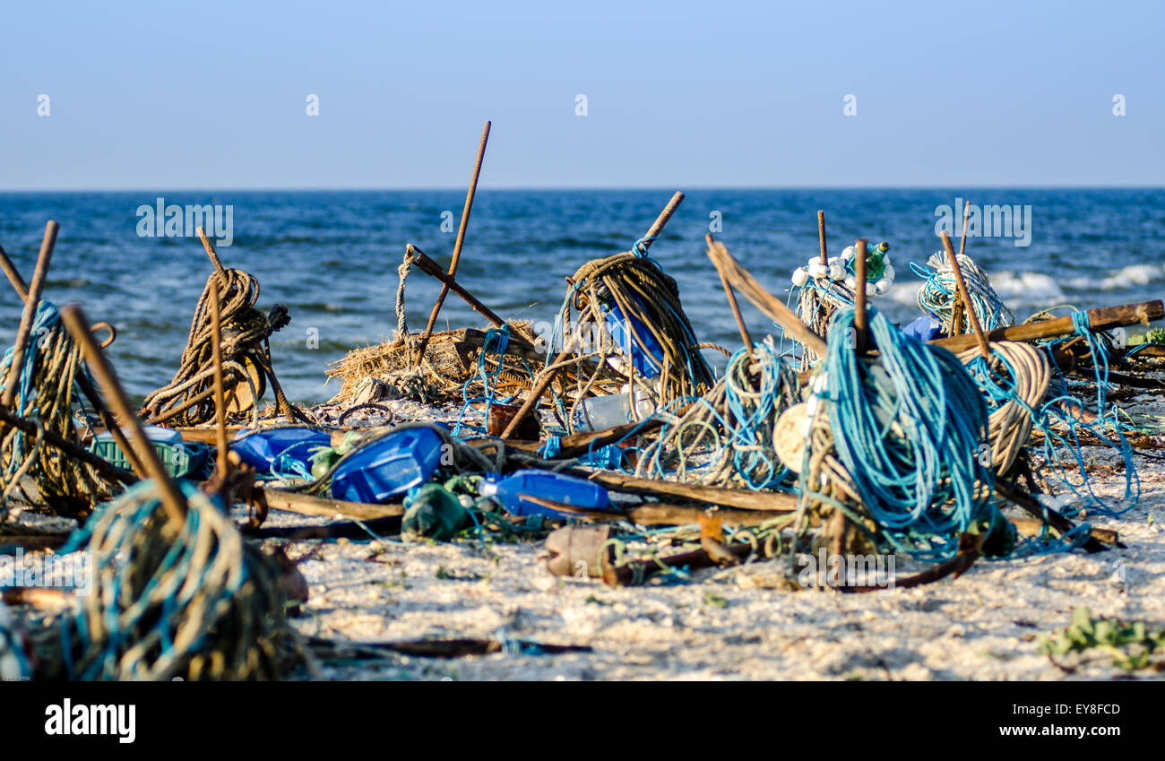 Fishing boats rest on the shore at a serene coastal location under ...