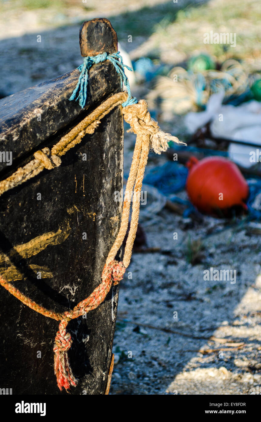 Fishing boats rest on the shore at a serene coastal location under ...