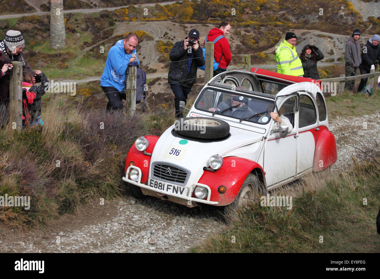 A red and cream Citroen 2CV car takes part in a hill climb event Stock ...