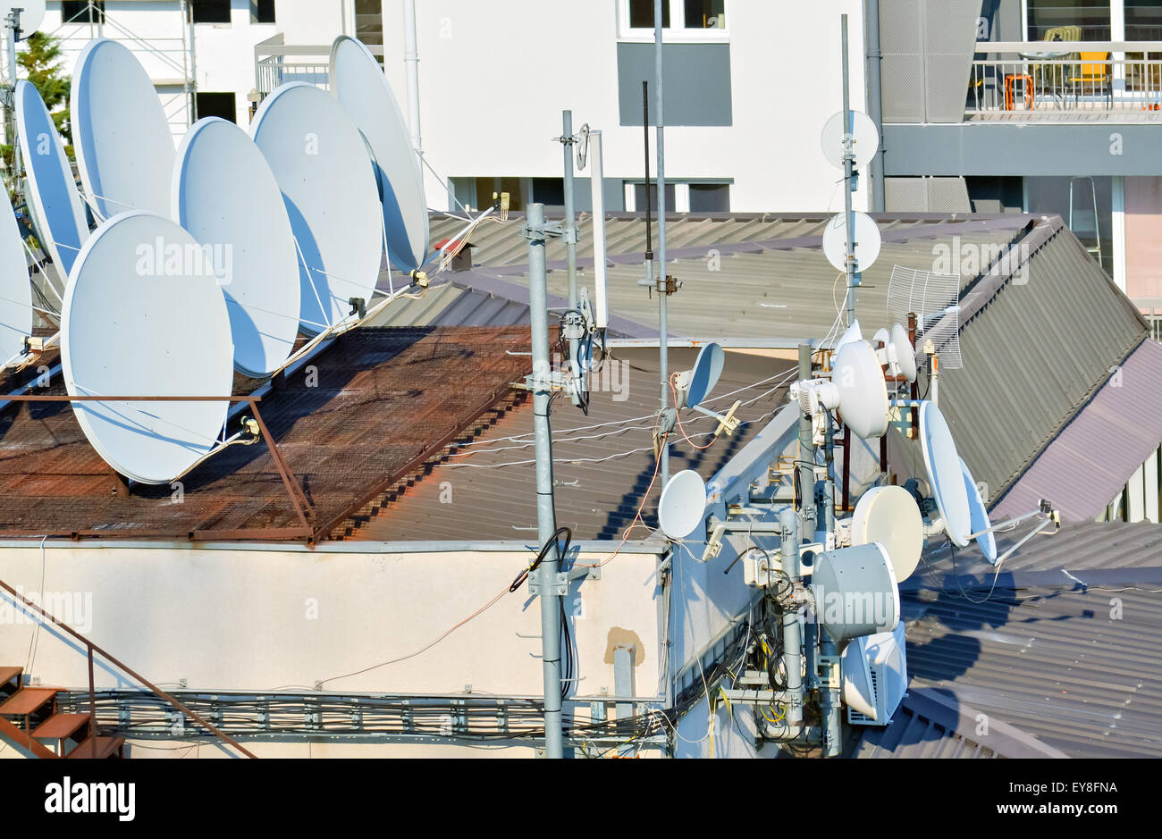 Antenna system on the roof of a building close to the homes of people ...