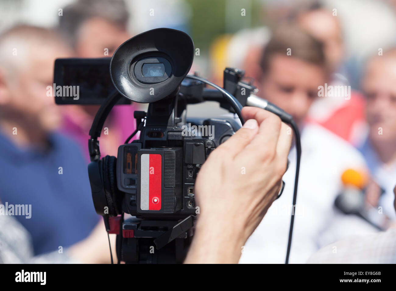 filming an media event with a video camera Stock Photo - Alamy