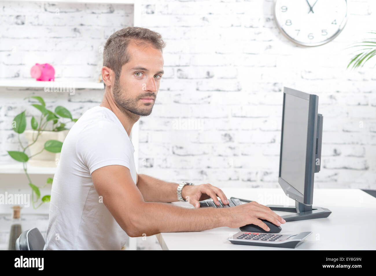 young executive working with his computer in his office Stock Photo - Alamy