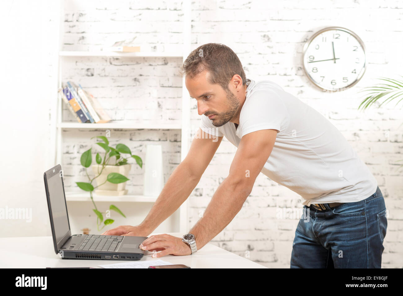 young executive working with his computer in his office Stock Photo - Alamy