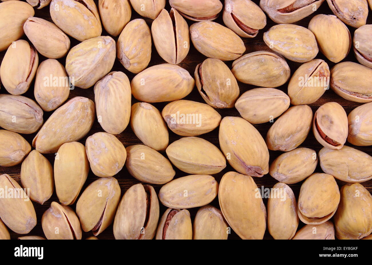 Roasted pistachio nuts as background, healthy food and nutrition Stock Photo - Alamy