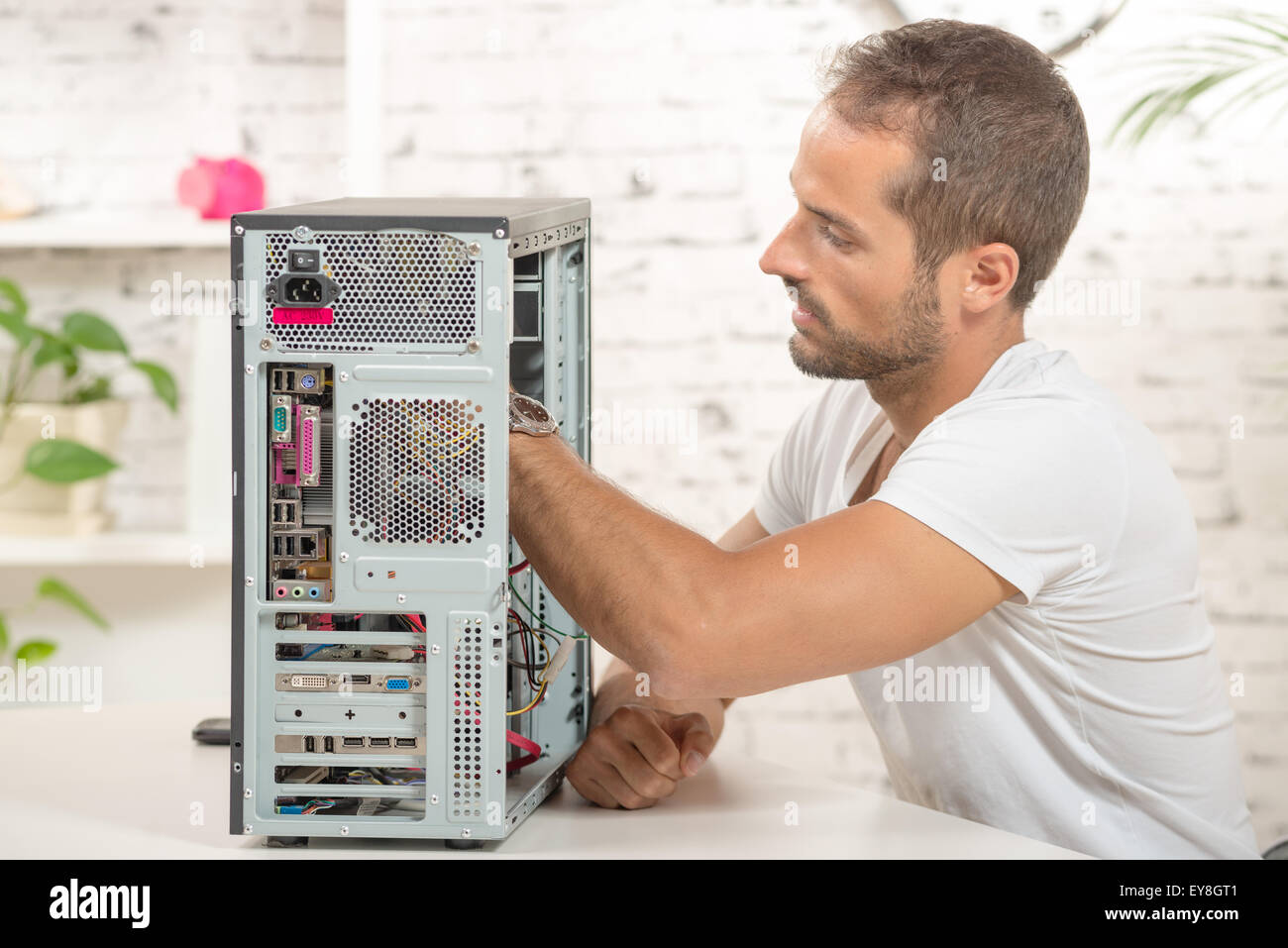 young engineer repaired a computer Stock Photo - Alamy