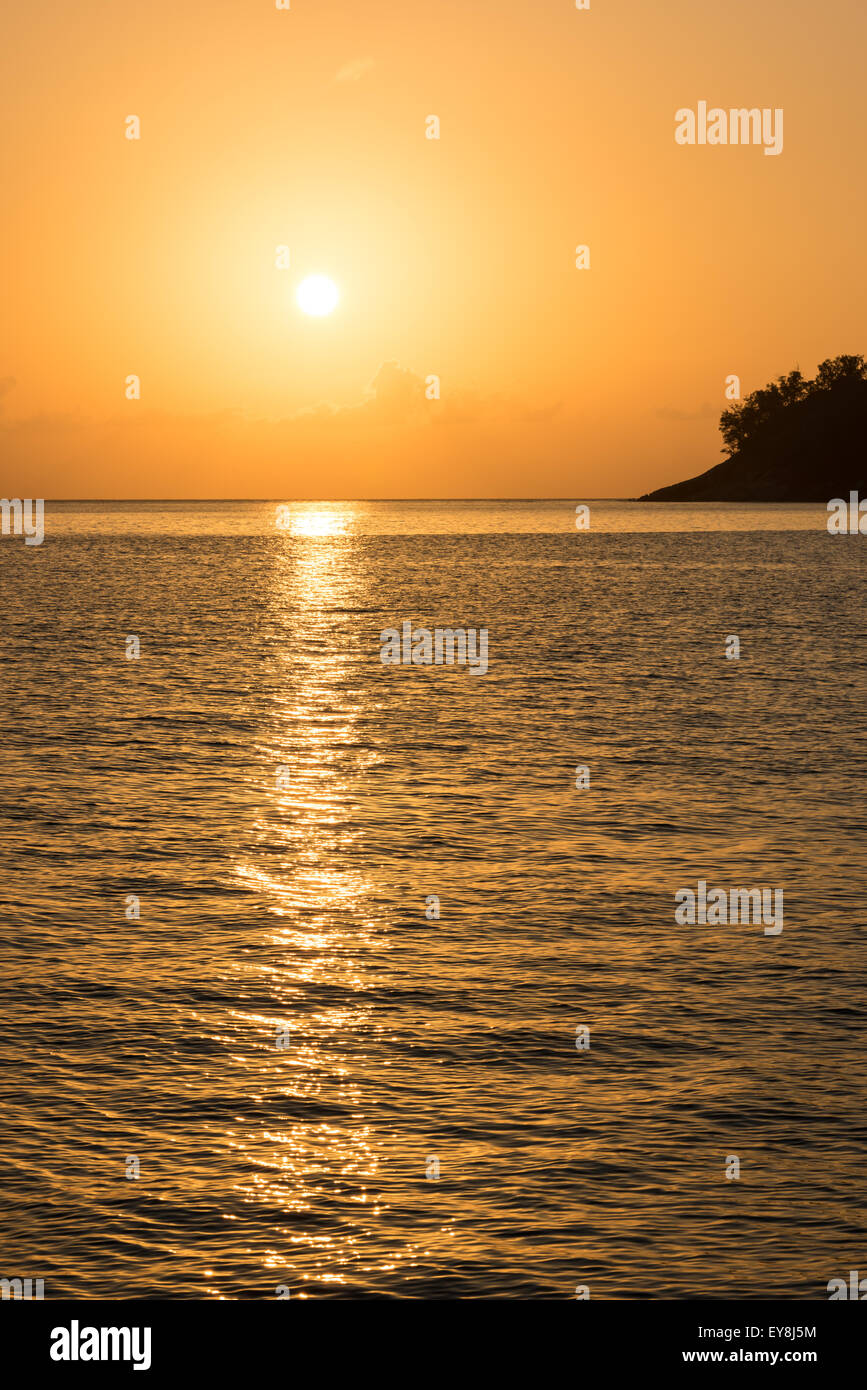 Beautiful tropical sunset ocean background. Vertical shot Stock Photo ...