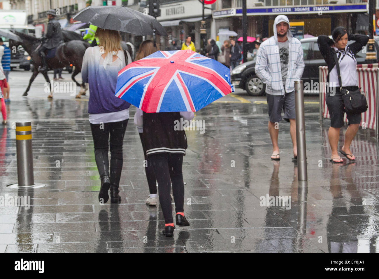 London,UK. 24th July 2015. Londoners endured a wet rainy day in London ...