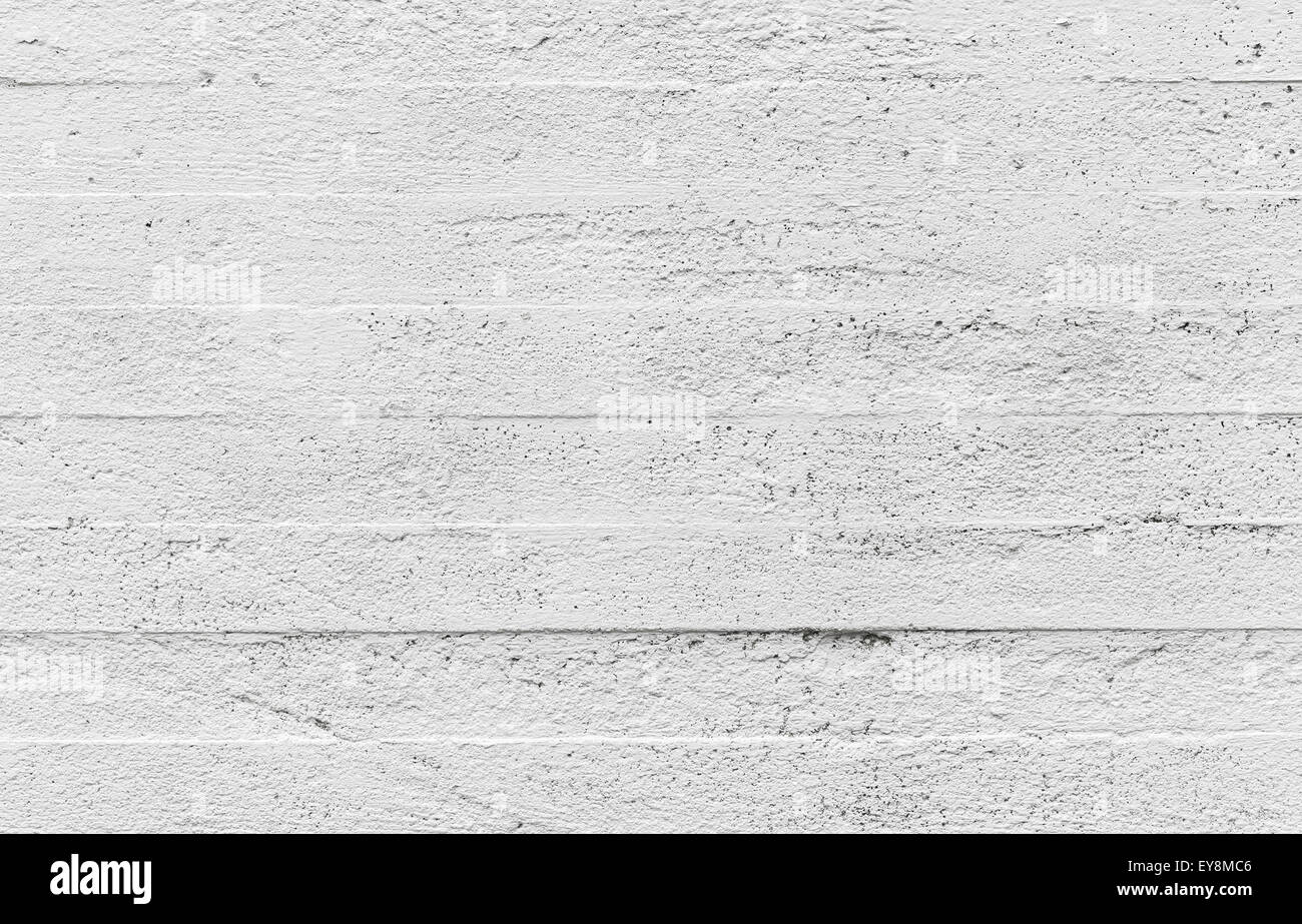 White concrete wall background texture with horizontal relief pattern ...