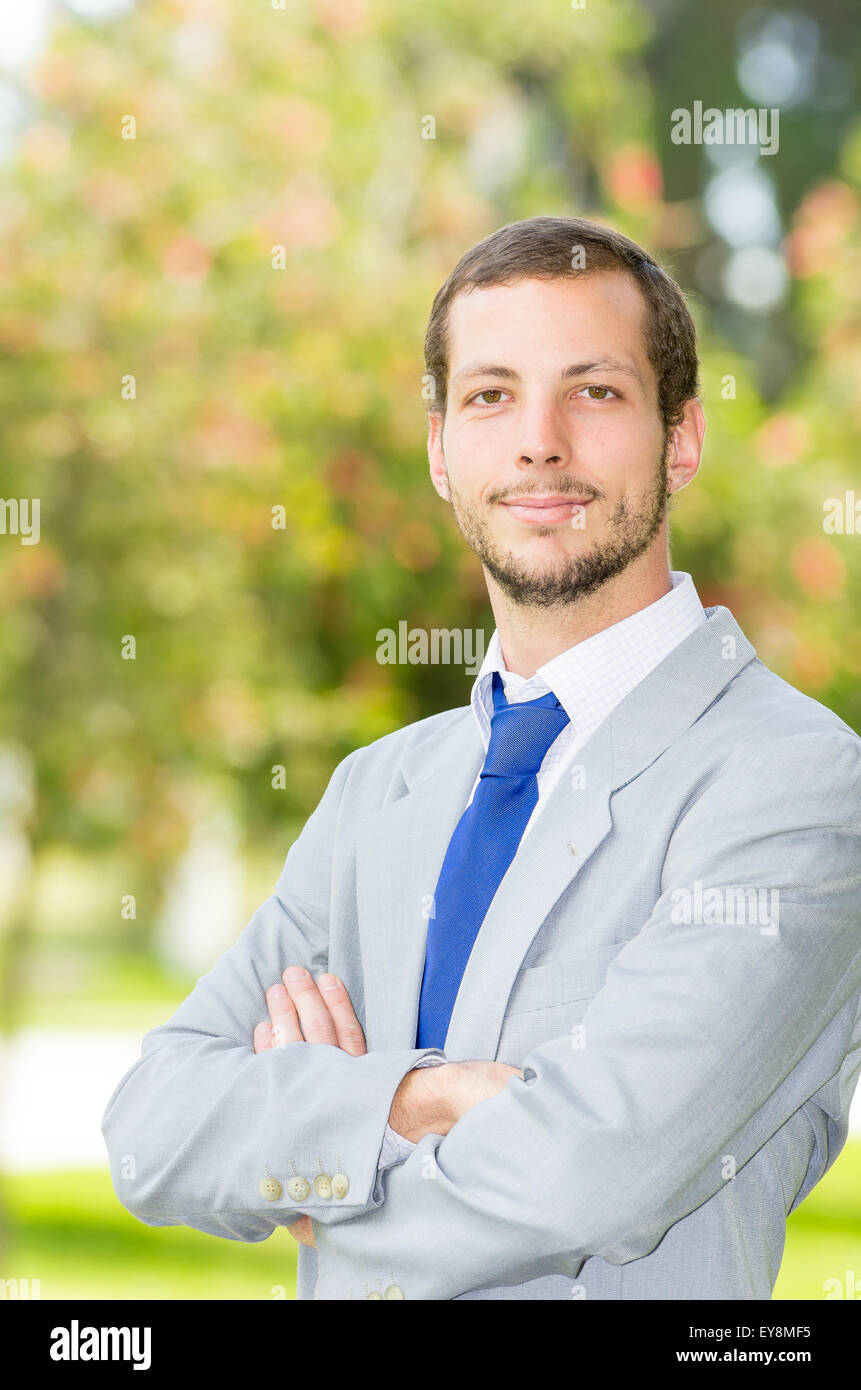 Handsome successful businessman professional in grey suit posing for ...