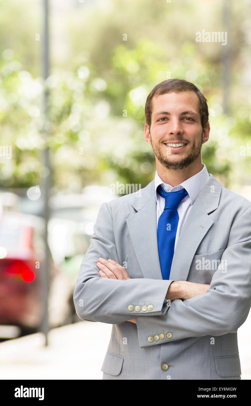 Handsome successful businessman professional in grey suit posing for ...