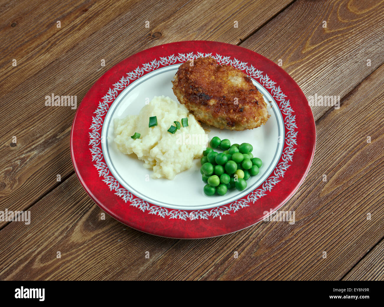 Kotlet schabowy - Polish variety of pork breaded cutlet coated with ...