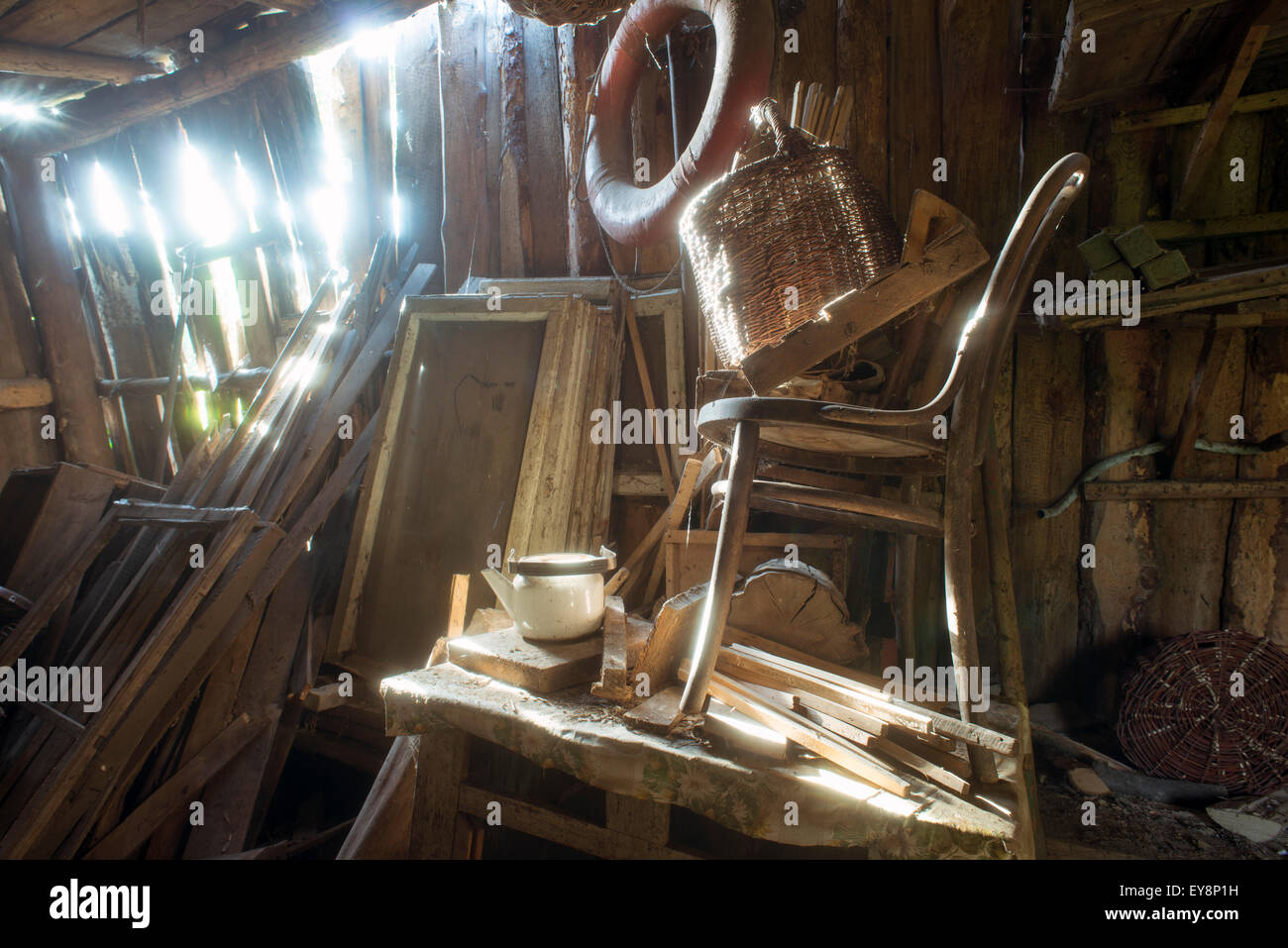 old wooden abandoned barn interior with bright sun beams fallen through ...