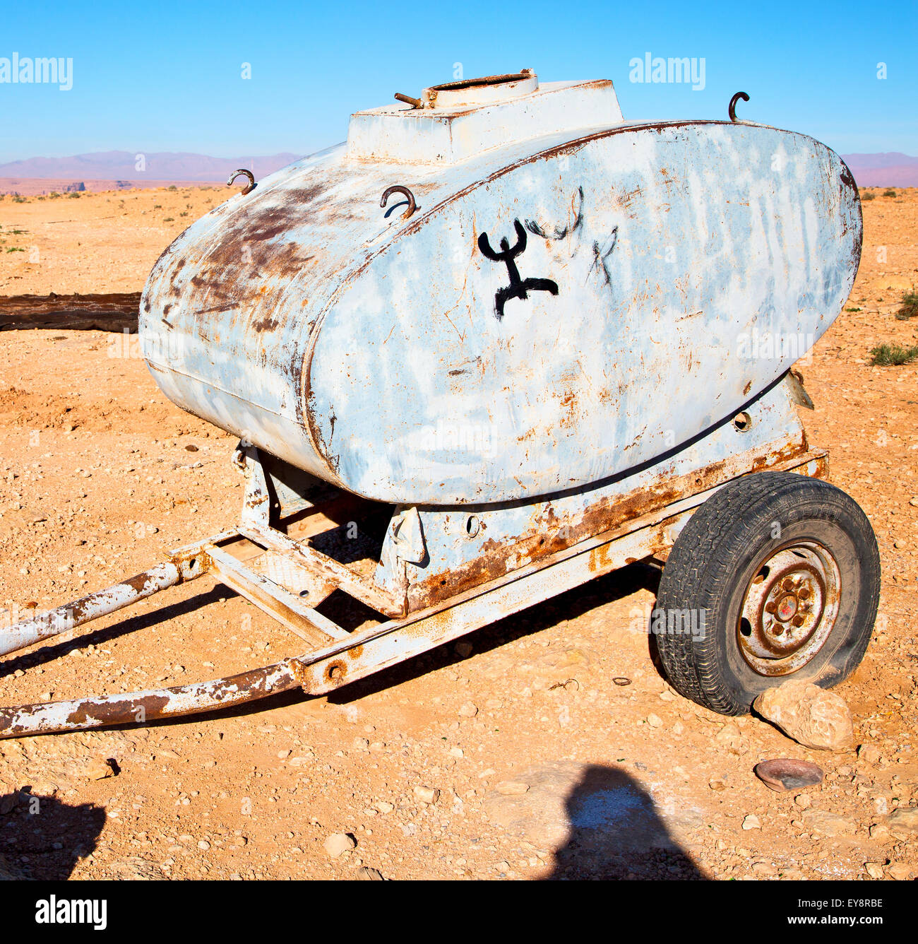 water tank in morocco africa land gray metal weel and arid Stock Photo ...
