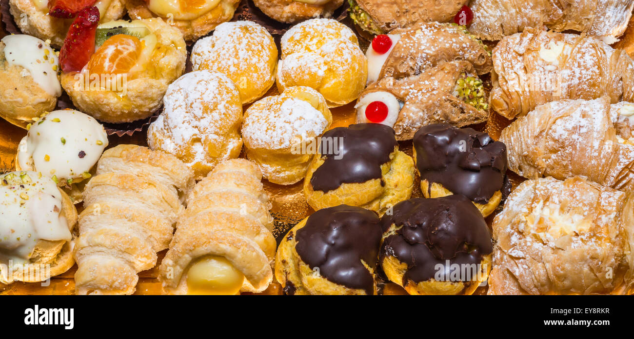colorful pastries with fruits, cream and chocolate, the real Italian ...