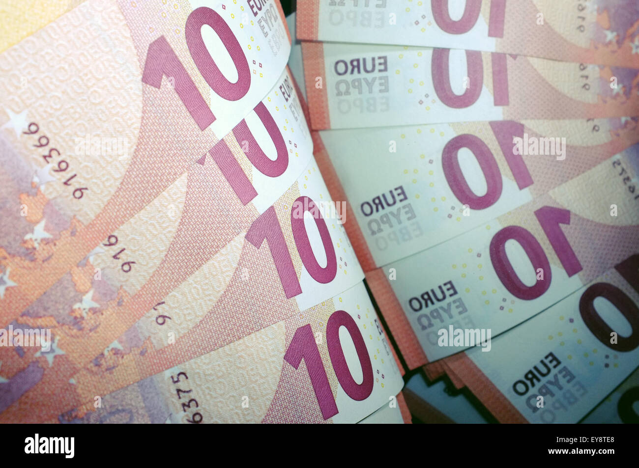 10 Euro notes held against a mirror Stock Photo - Alamy