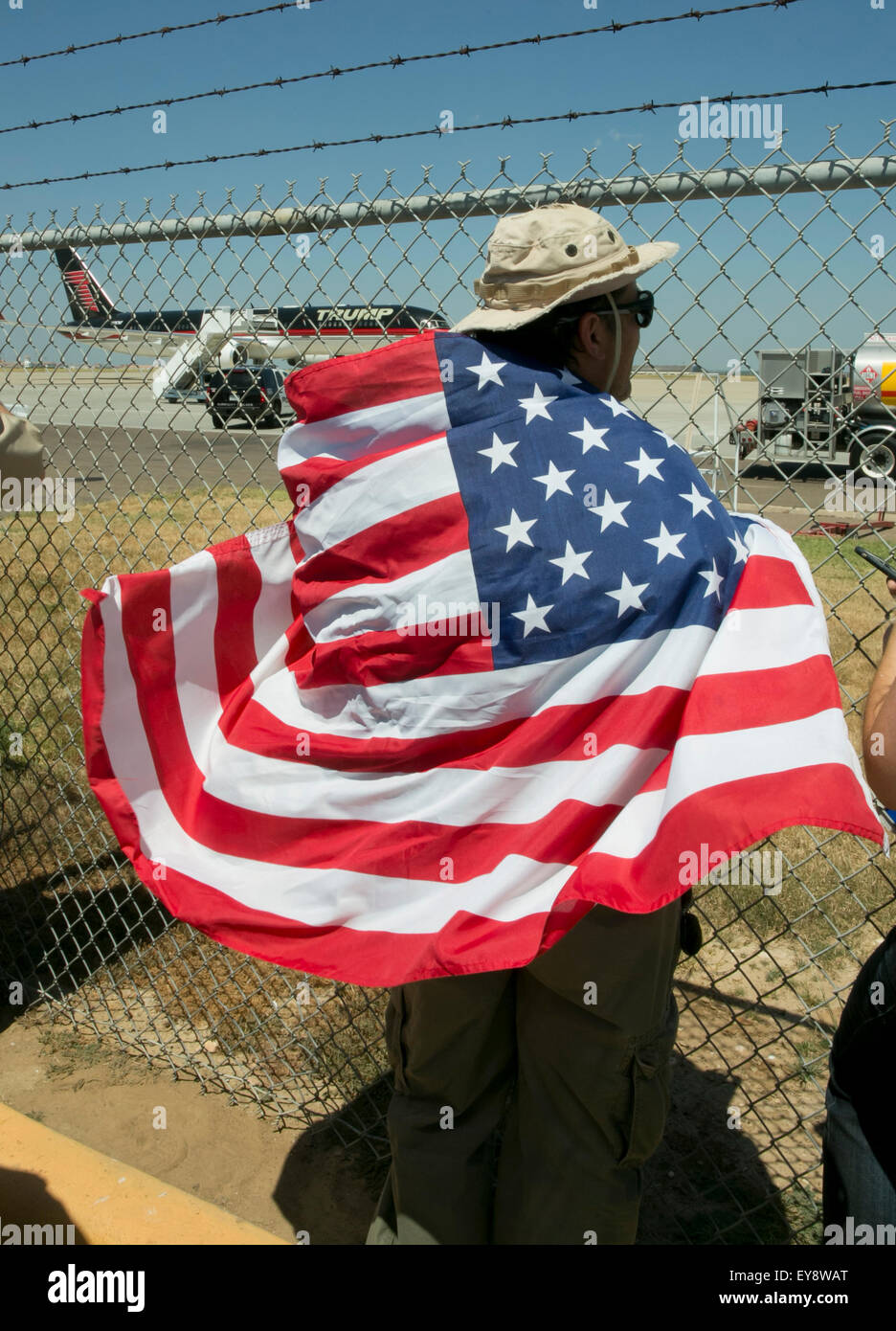 Laredo, Texas, USA. 22nd July, 2015. Joseph Diaz, with a US flag draped ...