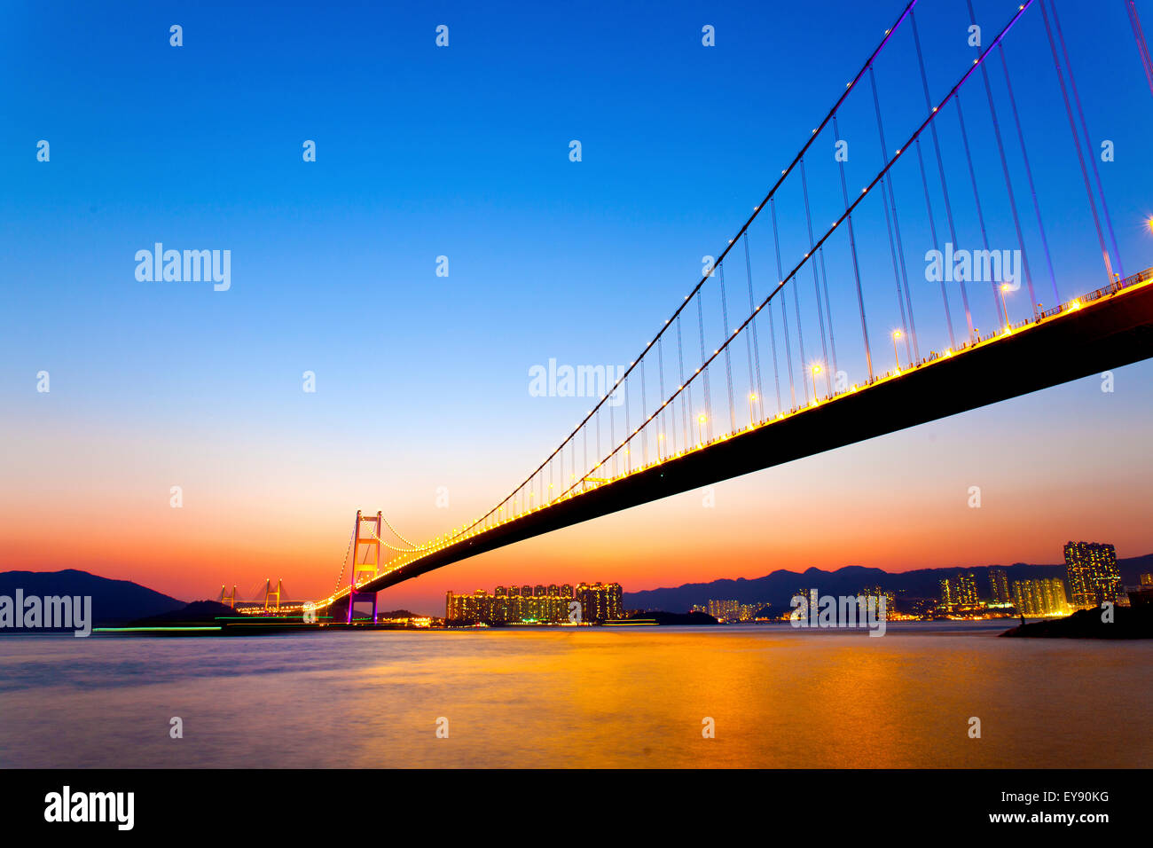Modern bridge connecting the city at sunset Stock Photo - Alamy