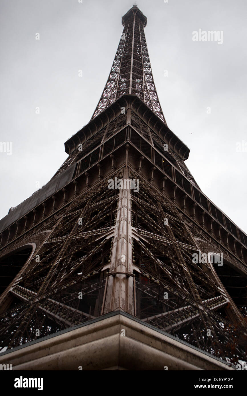 Looking up the Eiffel Tower on an overcast day in Paris, France Stock ...
