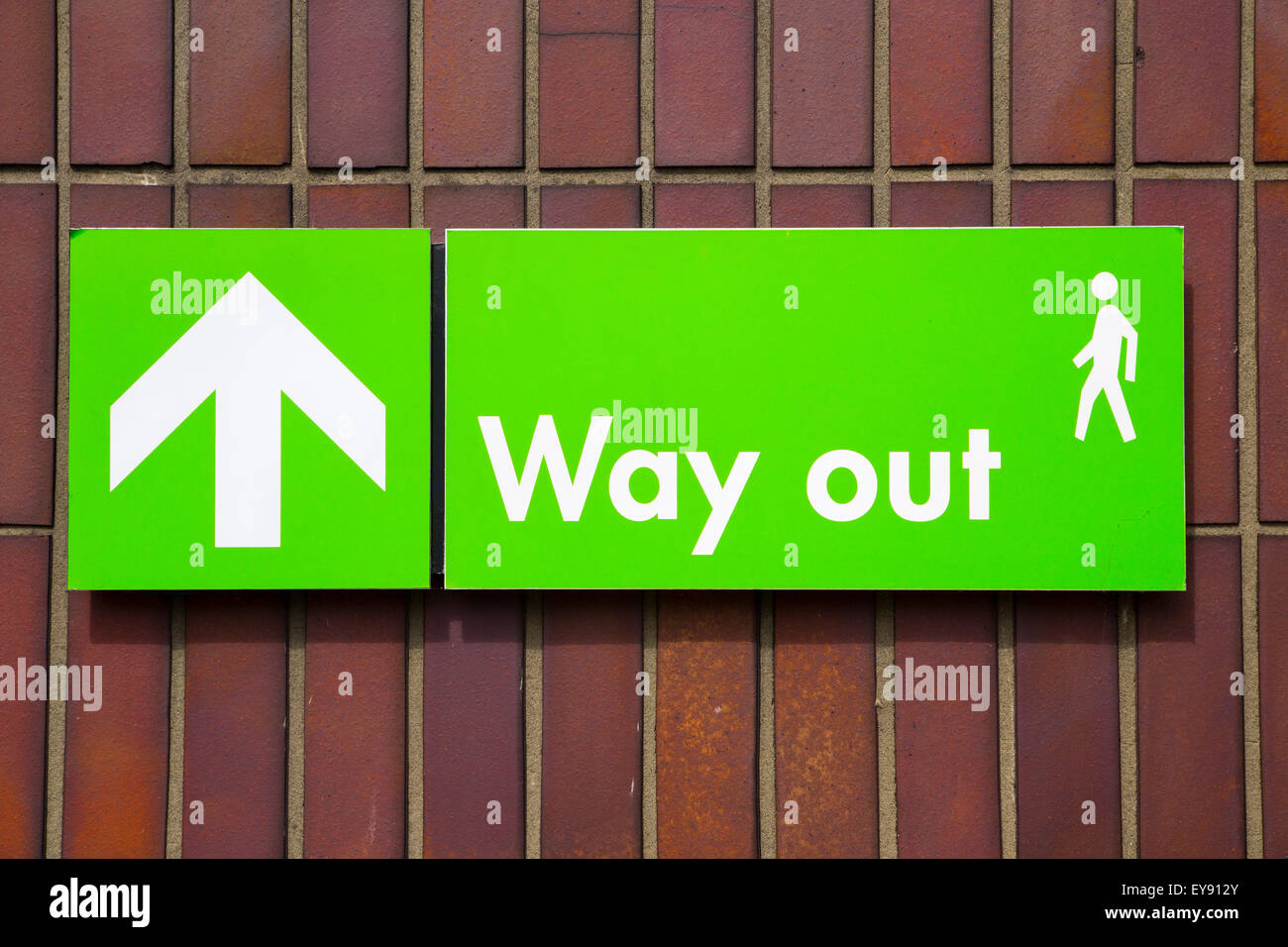 Way out sign with white writing and green background Stock Photo - Alamy