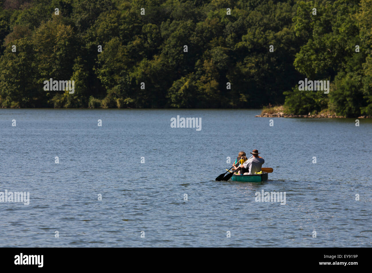 Family canoeing on Lake Macbride at Lake Macbride State Park, near ...