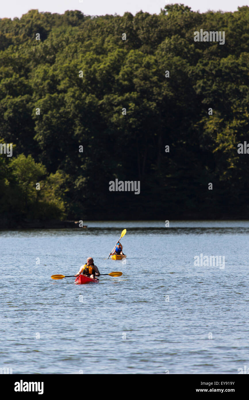 Two people kayaking on Lake Macbride in Lake Macbride State Park, near ...