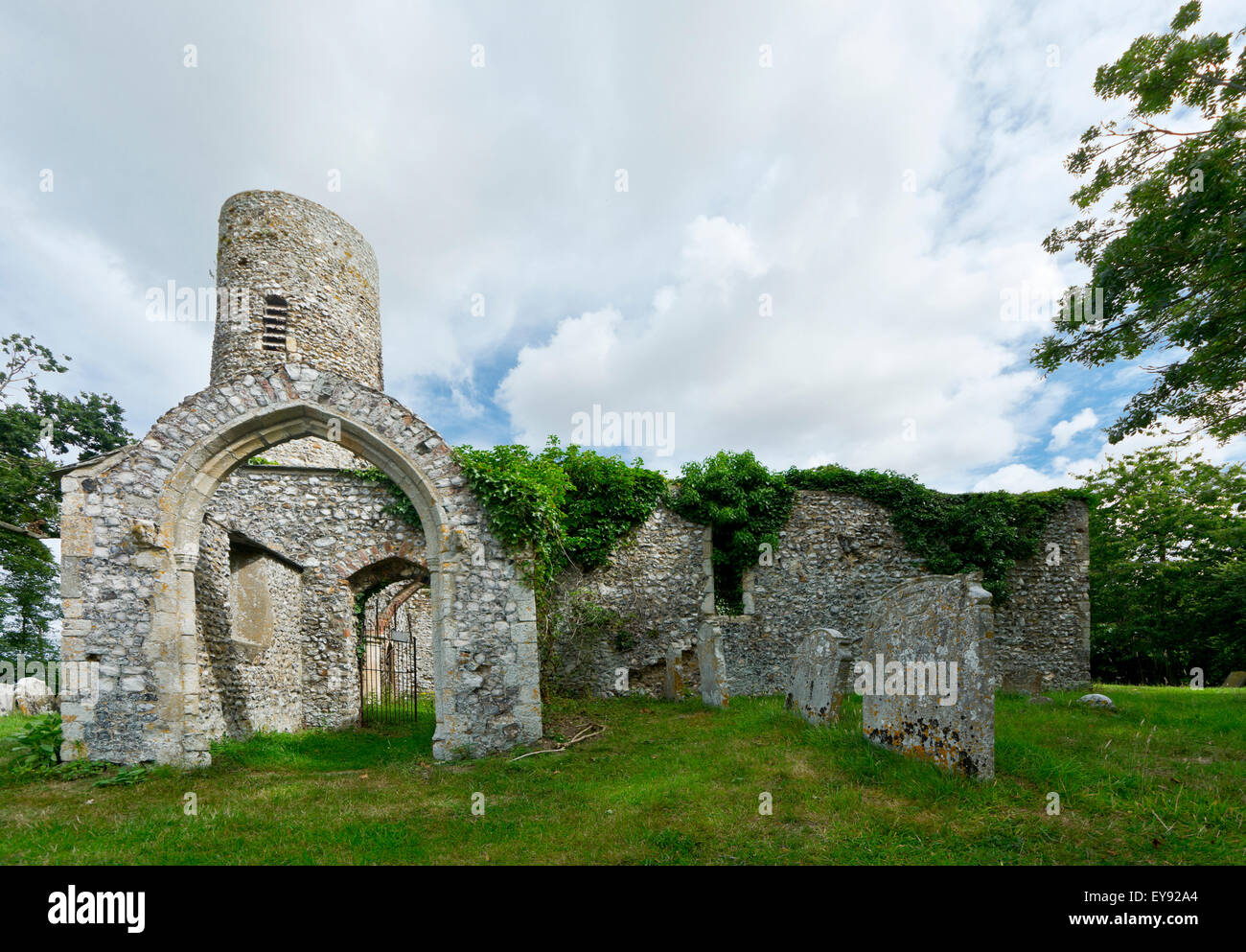 Church ruins old flint round tower Stock Photo - Alamy
