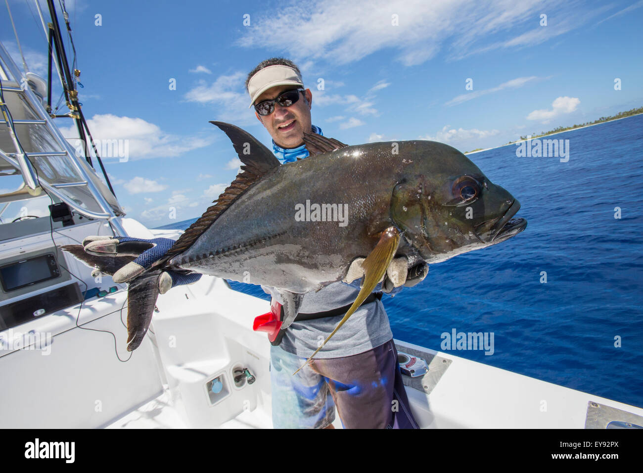 Fisherman holds a fresh caught Jack Fish; Tahiti Stock Photo - Alamy
