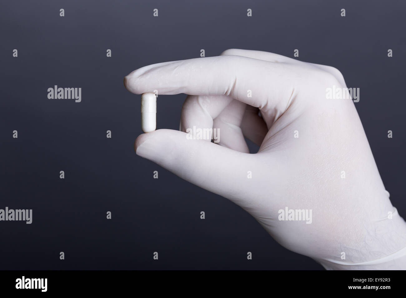 Hand with capsule Stock Photo - Alamy