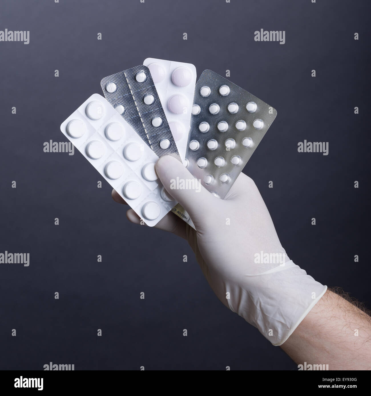 Hand with pills blisters Stock Photo - Alamy