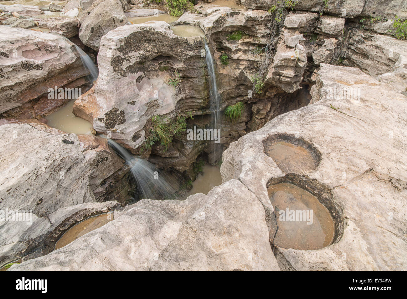 Uniquely carved rocks around a waterfall in Toro Toro National Park ...