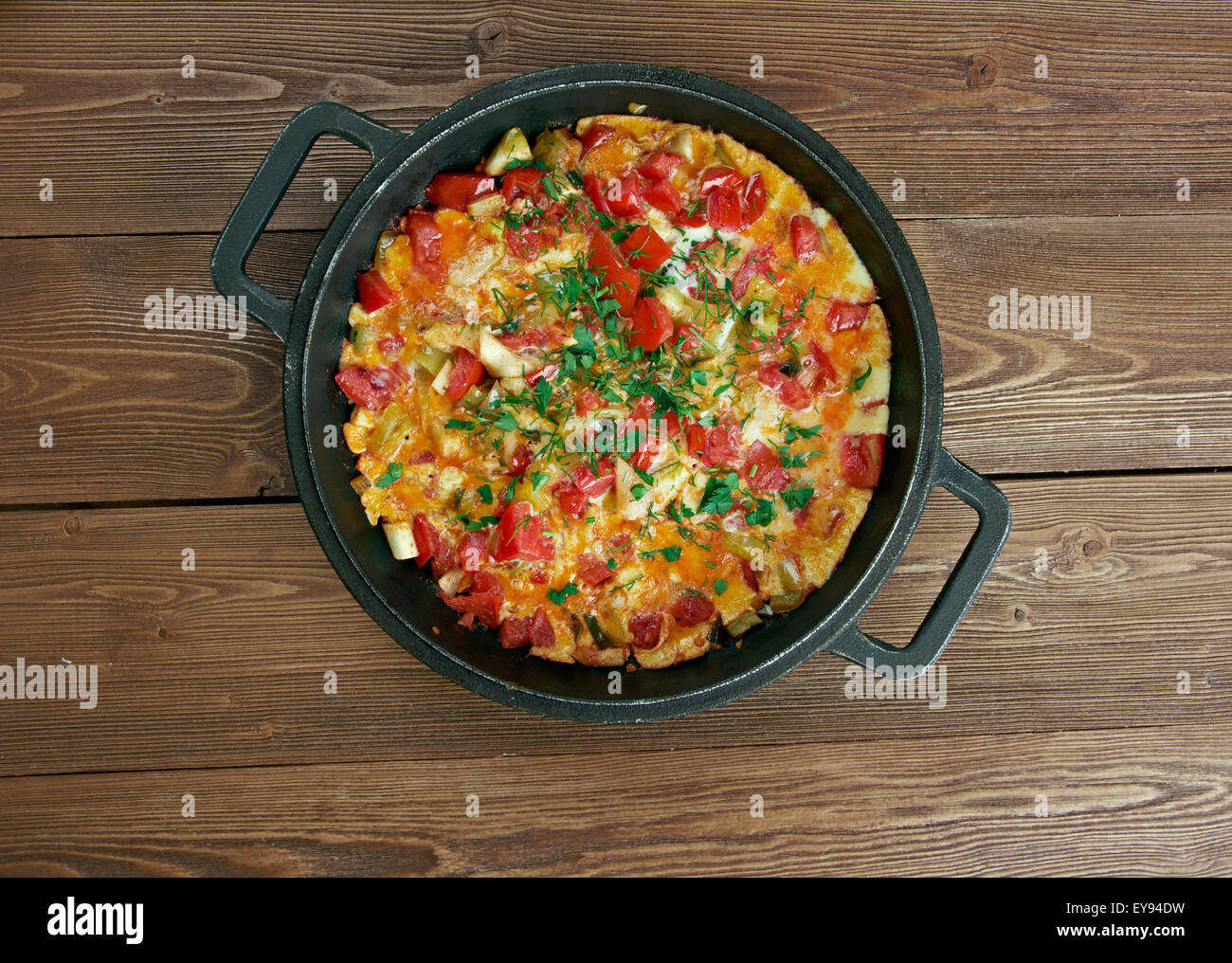 Menemen - traditional Turkish dish.includes eggs, onion, tomato, green ...