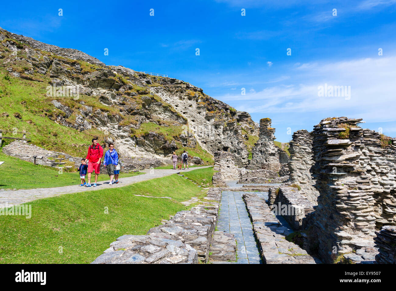 Tourists at the ruins of Tintagel Castle, a site linked with the legend ...