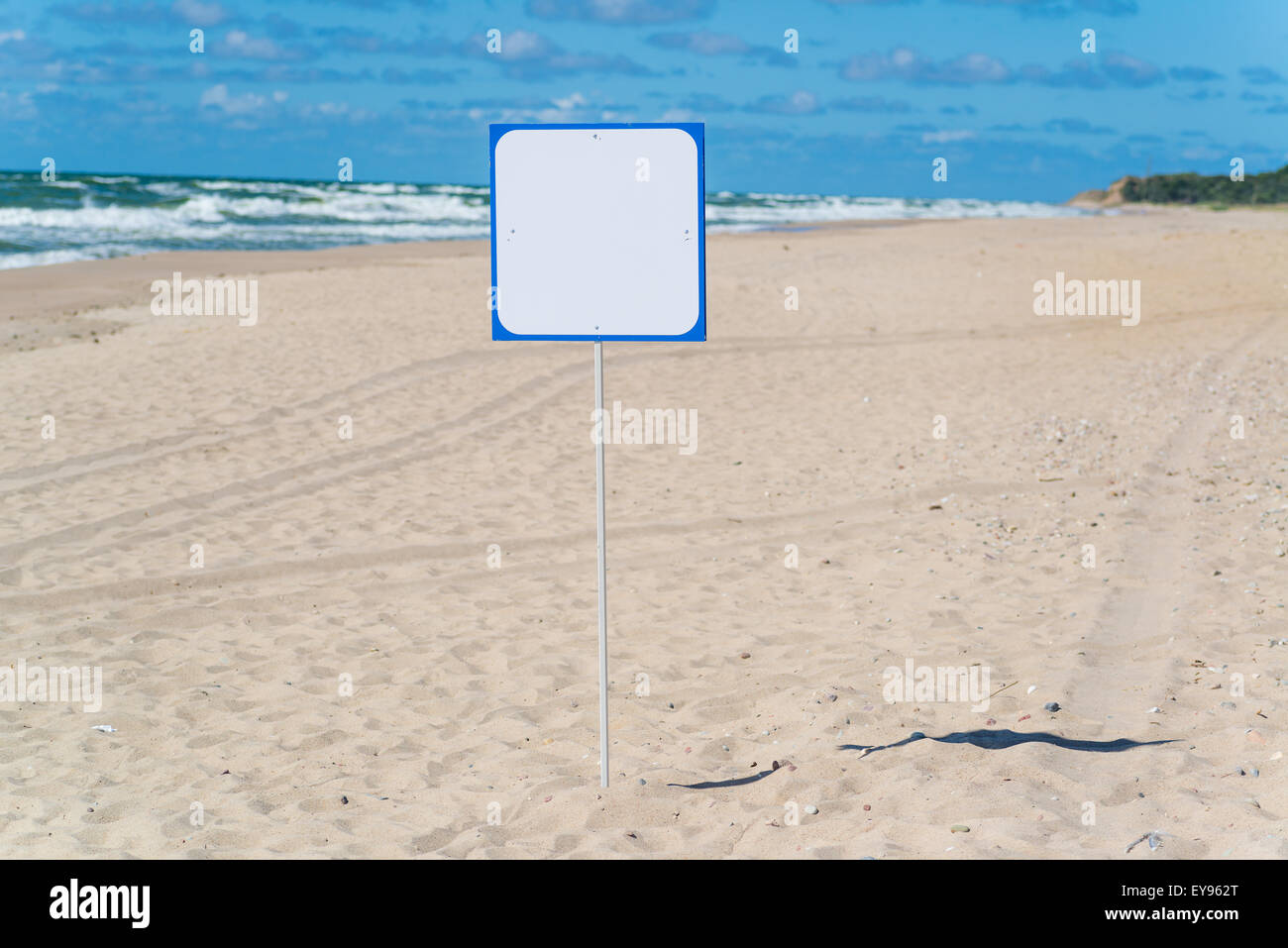 White empty signboard on the beach Stock Photo - Alamy
