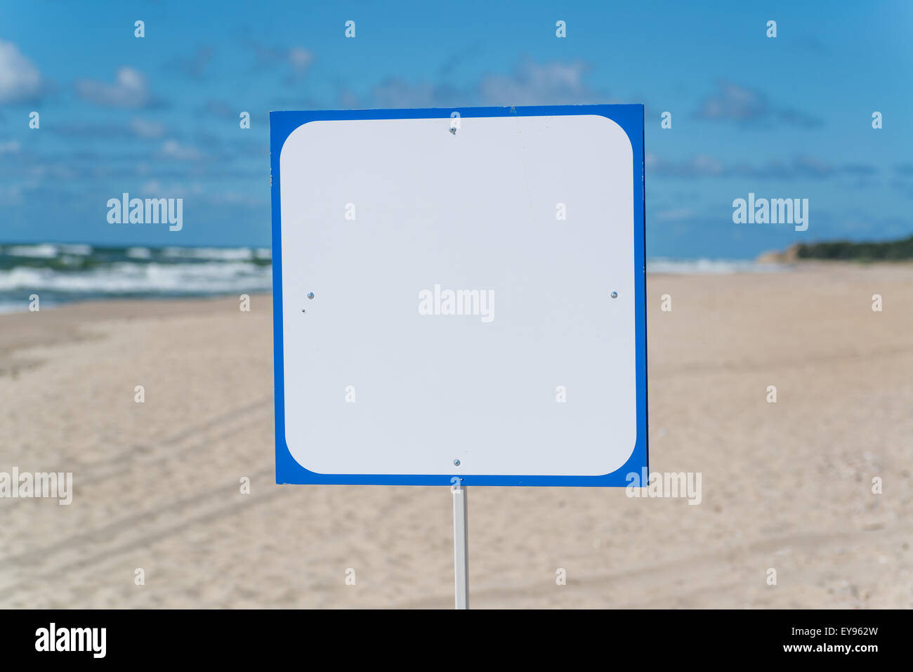 White empty signboard on the beach Stock Photo - Alamy