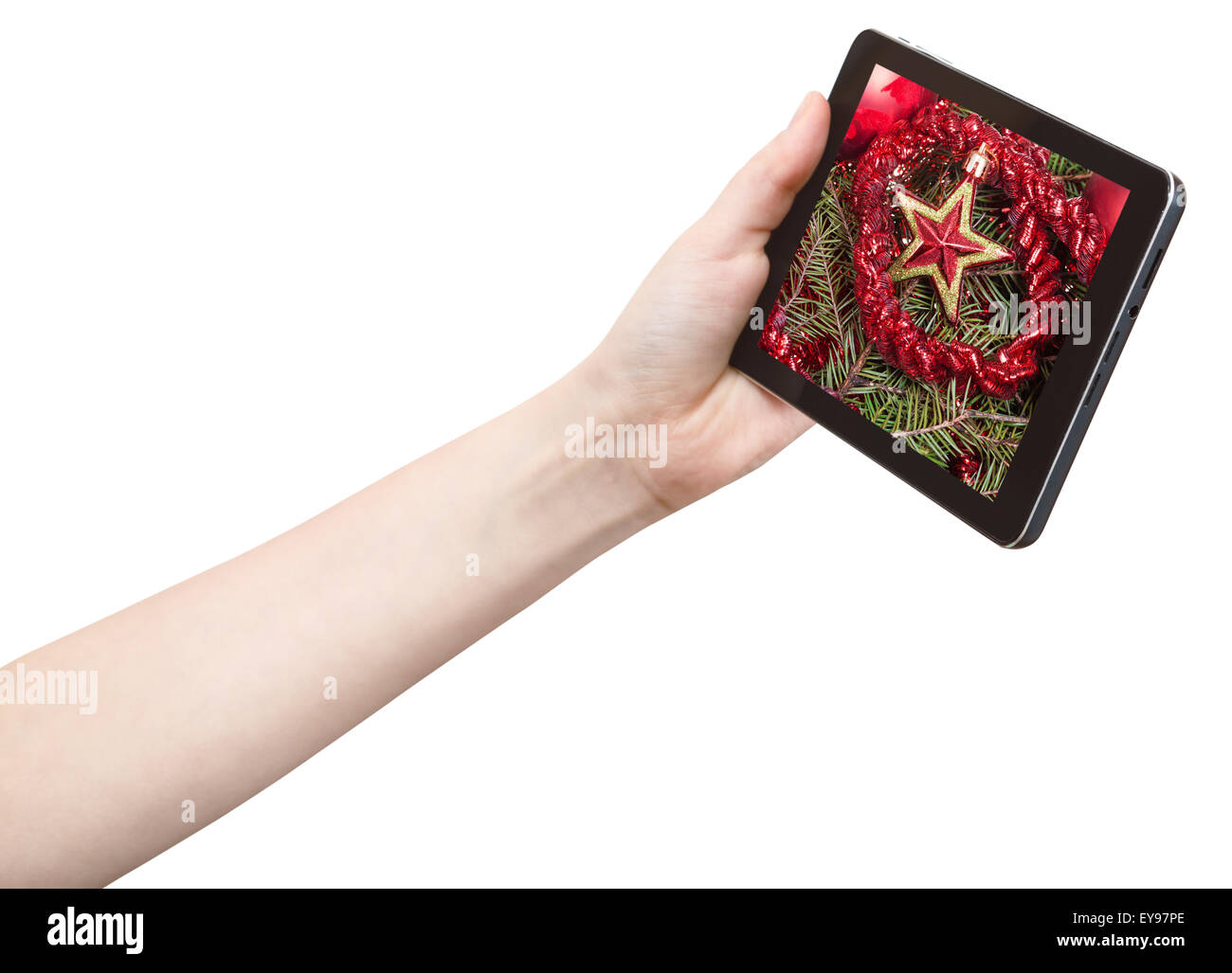 hand holds tablet pc with red star and tinsel on screen isolated on ...