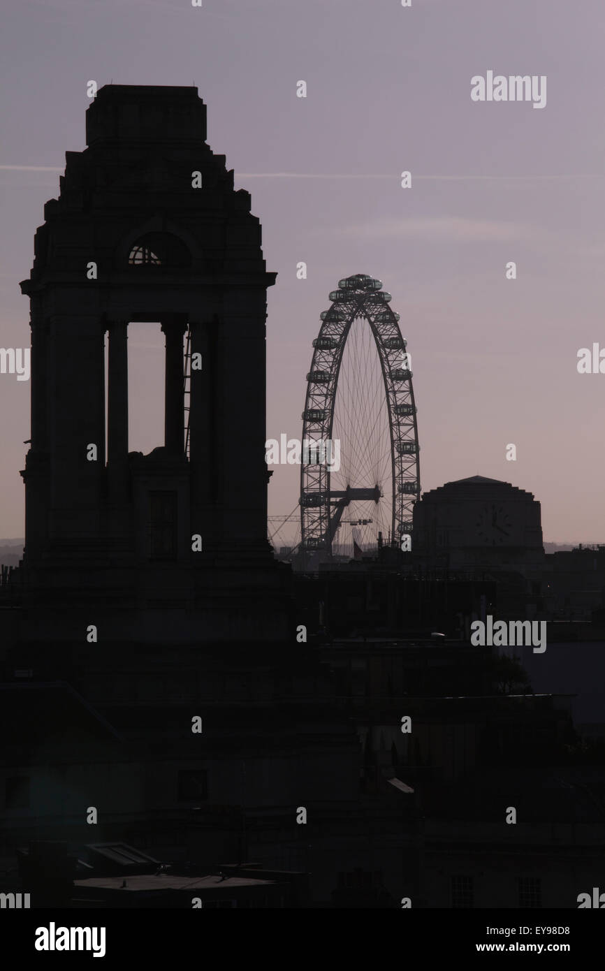 Freemason's Hall and the London Eye seen in silhouette above the ...