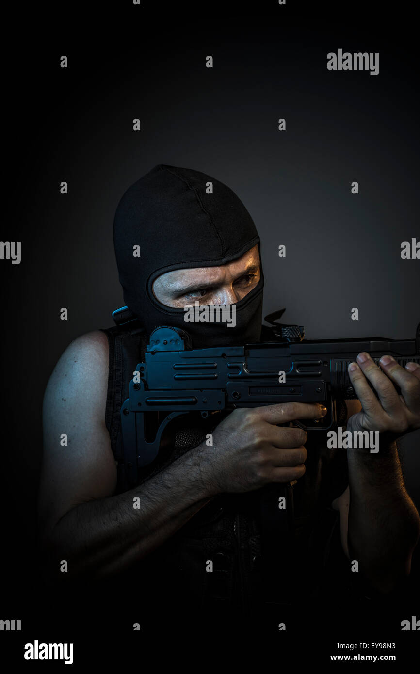 Bandit, Man wearing balaclavas and bulletproof vest with firearms Stock ...