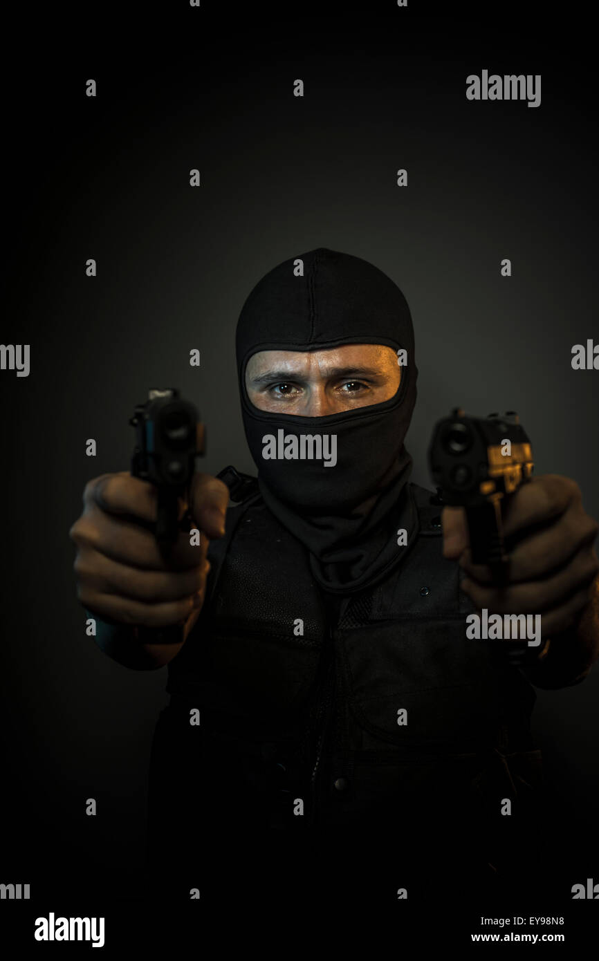 Gangster, Man wearing balaclavas and bulletproof vest with firearms ...