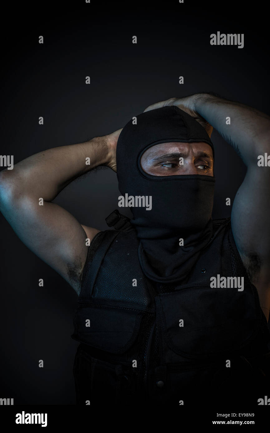 Man wearing balaclavas and bulletproof vest with firearms Stock Photo ...