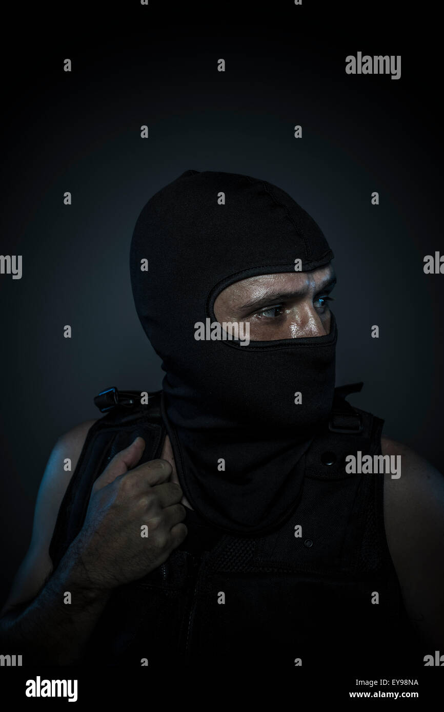 Man wearing balaclavas and bulletproof vest with firearms Stock Photo ...