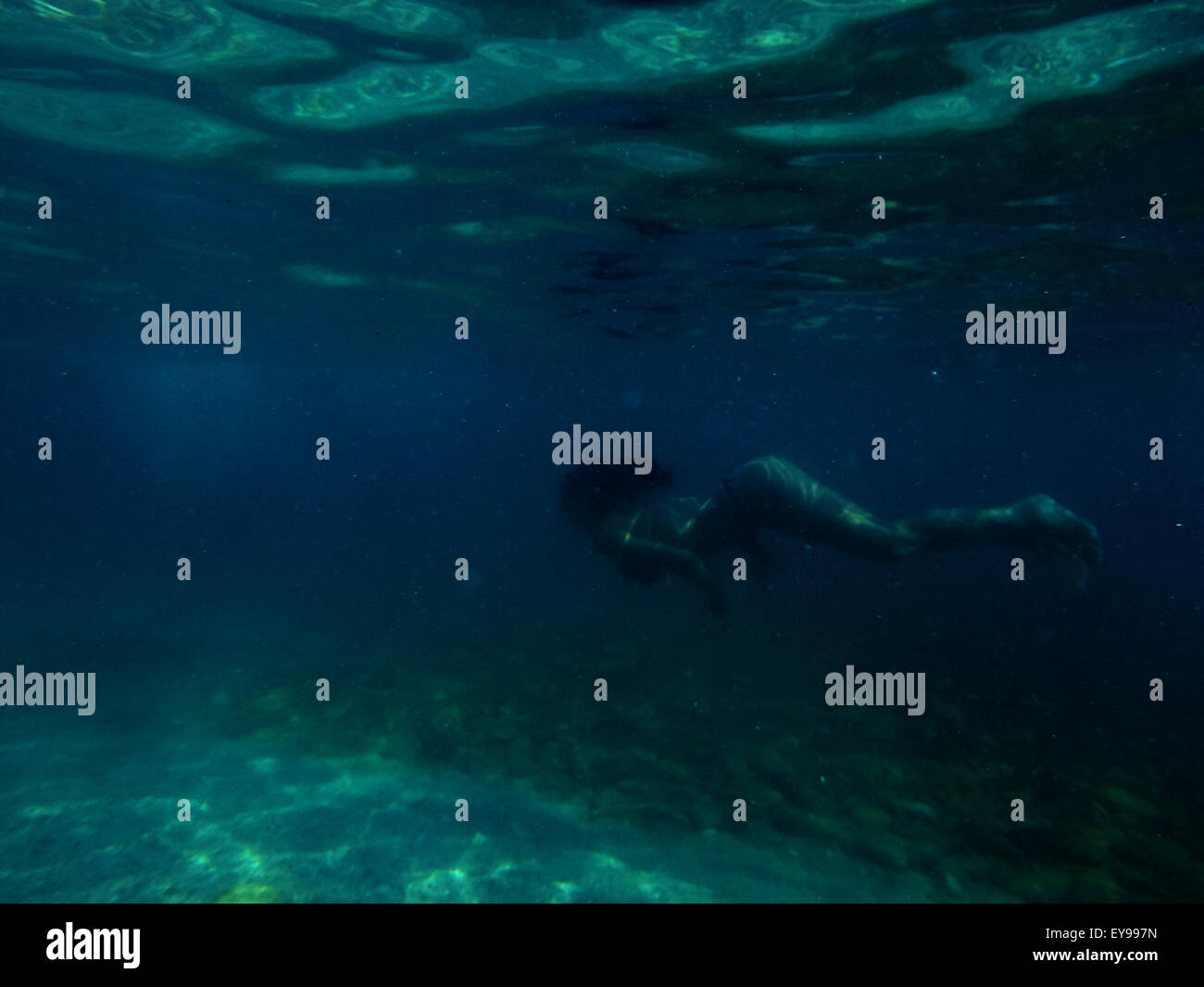 Attractive young woman having fun in underwater world Stock Photo - Alamy