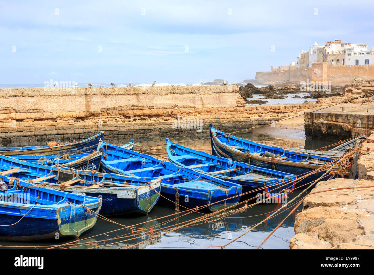 Beautiful blue boats in Essaouira old harbor, Morocco Stock Photo - Alamy