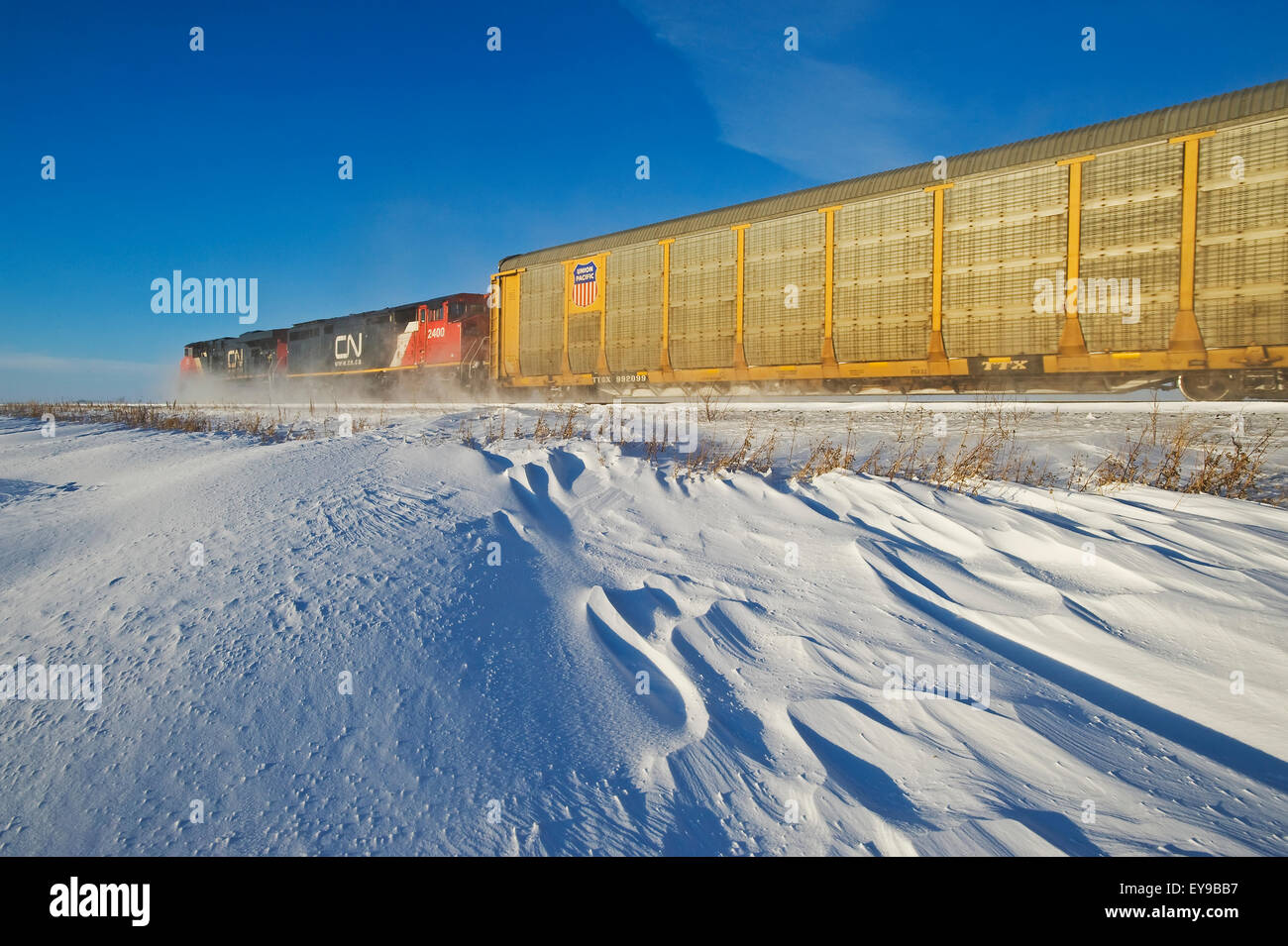 Freight train blowing snow as it travels near Winnipeg; Manitoba ...