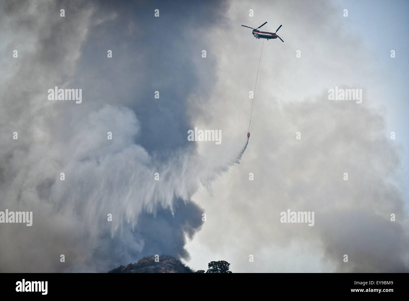 July 23, 2015 - Vacaville And Placerville, CA, USA - A helicopter drops ...