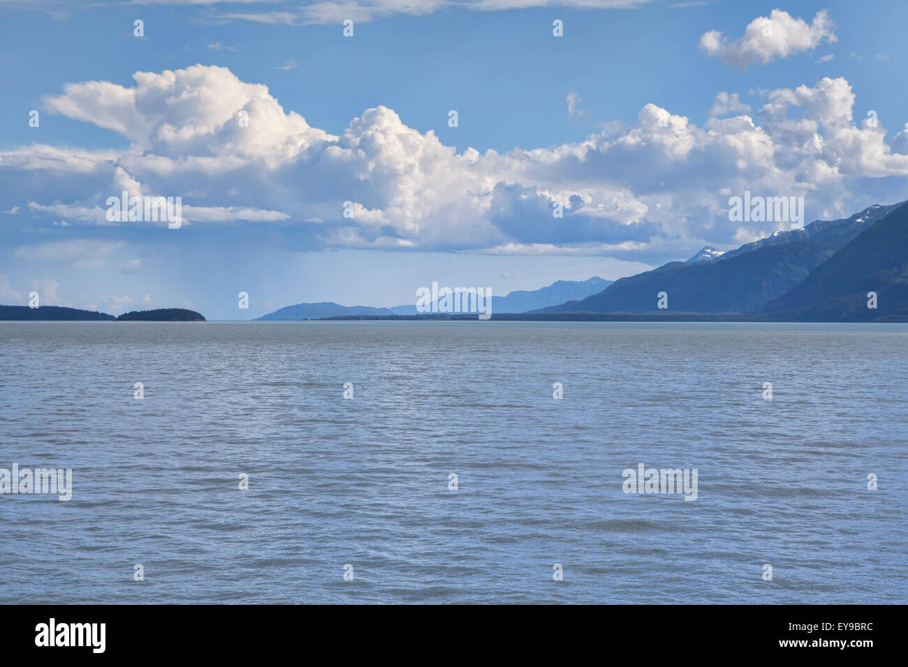Puffy clouds forming over the Chilkat Inlet in Southeast Alaska in ...