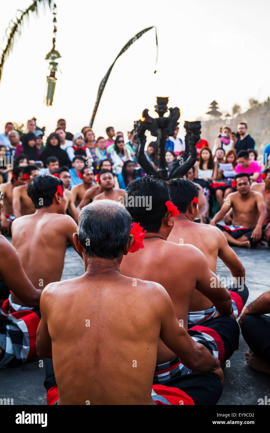 Men sitting in a circle chanting in trance during a Kecak dance ...