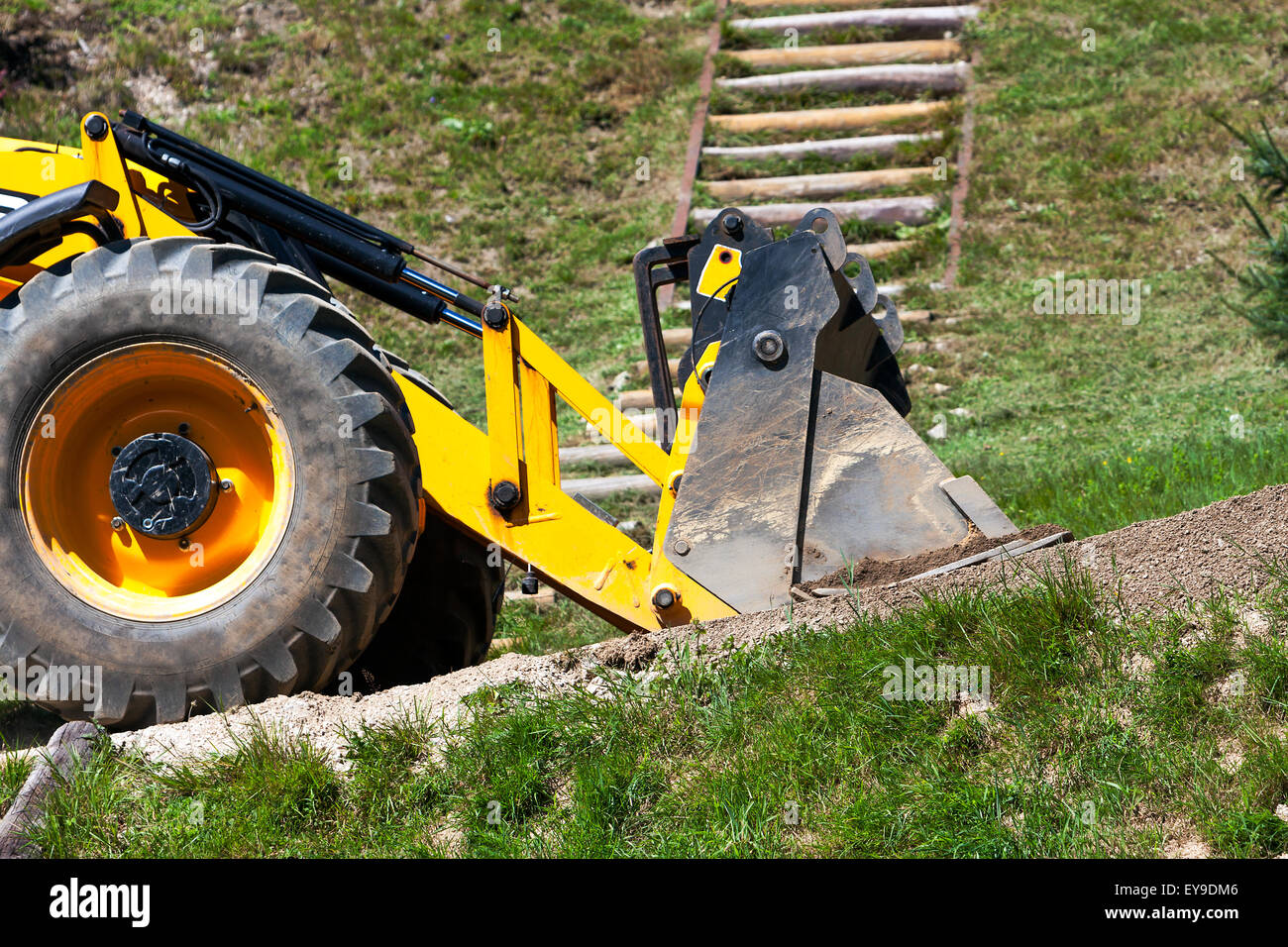 Excavator digging up road hi-res stock photography and images - Alamy
